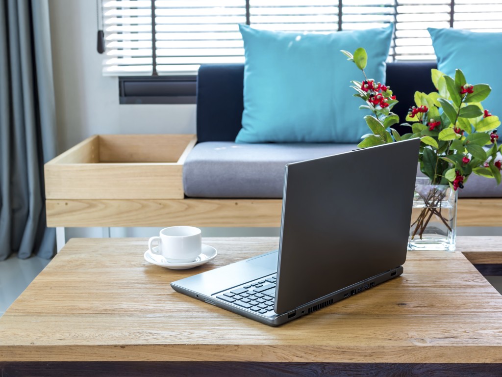 Modern interior Living room with laptop computer on table top - HSW ...